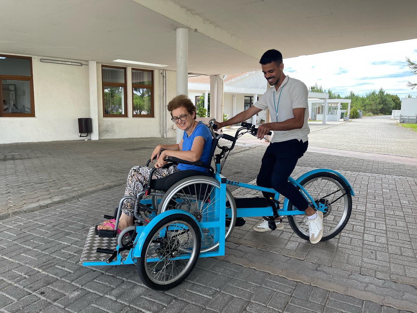 An adapted bicycle that allows people in wheelchairs to go sightseeing ...